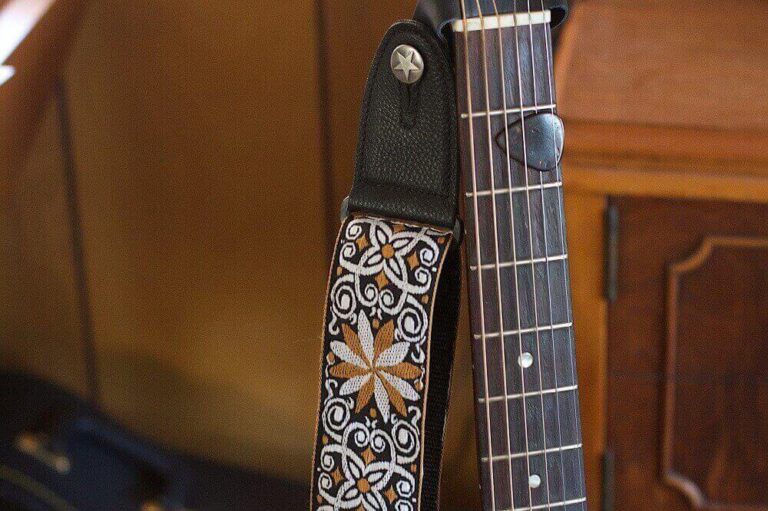 How To Properly Wear A Guitar Strap? | Low vs High or Style vs Health